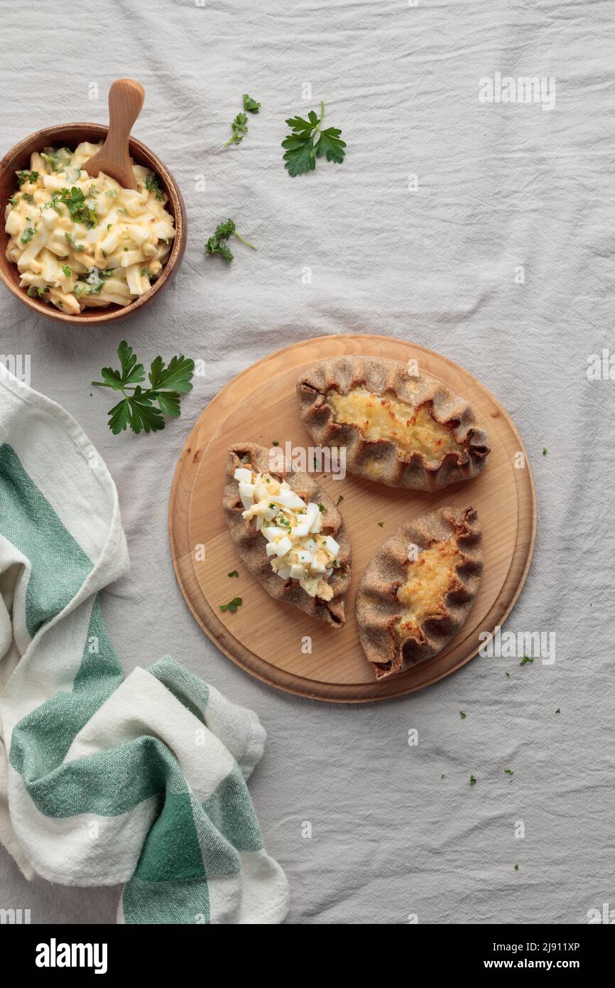 Traditional Finnish pastry - Karelian rye pie with rice porridge and an ...