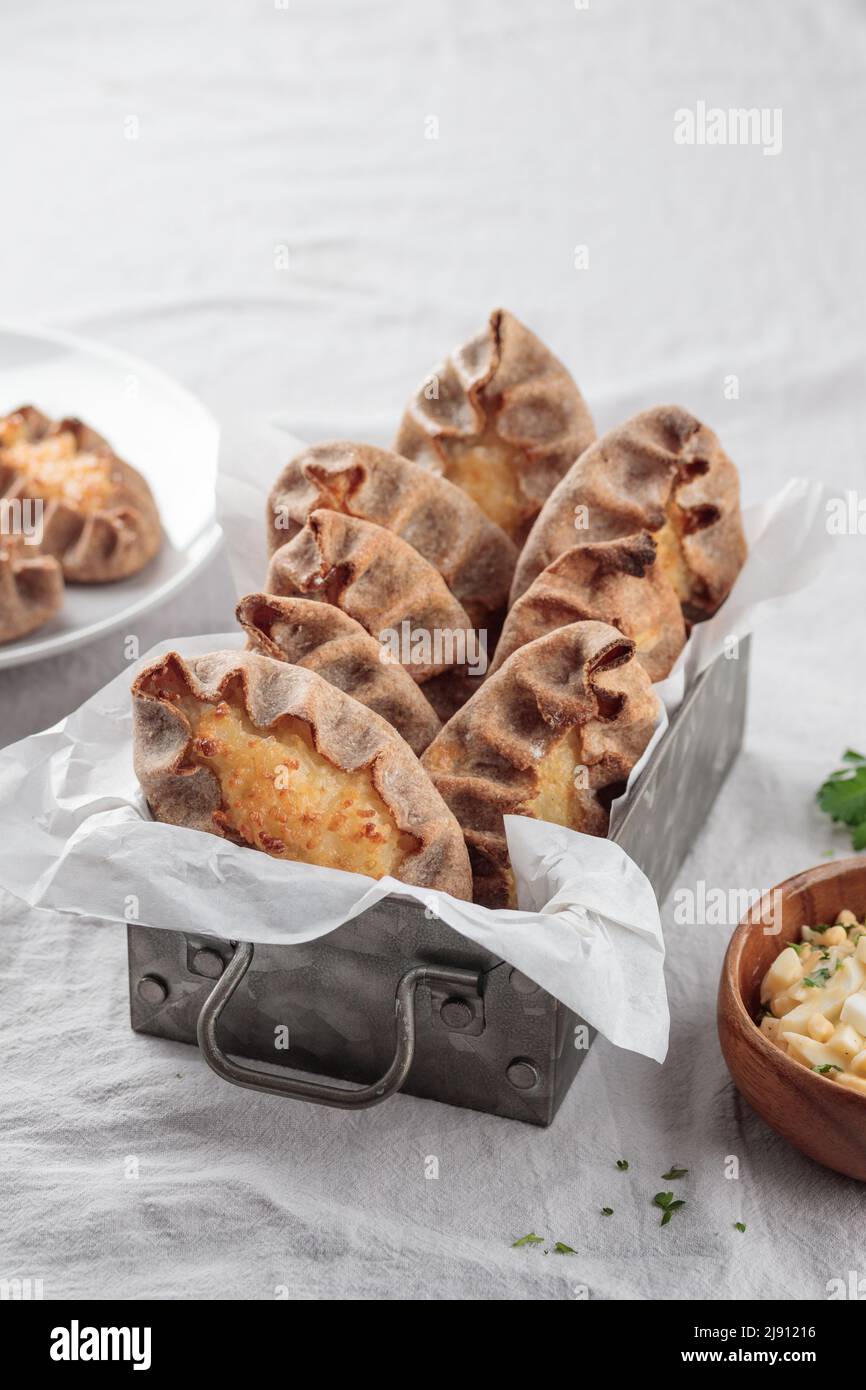 Traditional Finnish pastry - Karelian rye pie with rice porridge and an ...