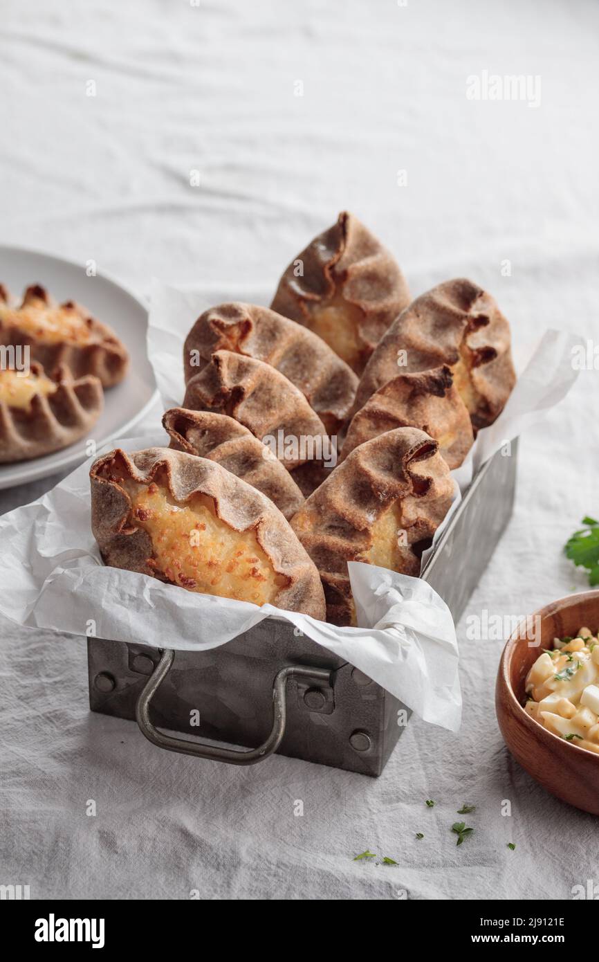 Traditional Finnish pastry - Karelian rye pie with rice porridge and an ...