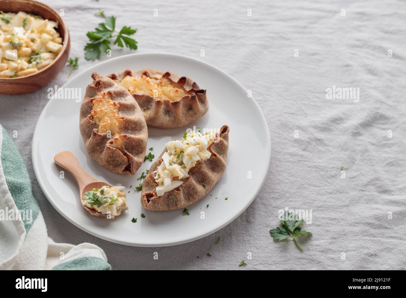 Traditional Finnish pastry - Karelian rye pie with rice porridge and an ...