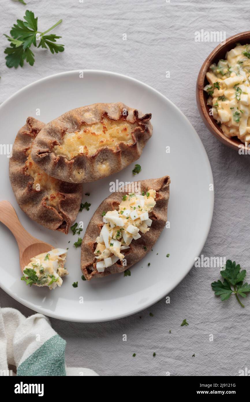 Traditional Finnish pastry - Karelian rye pie with rice porridge and an ...