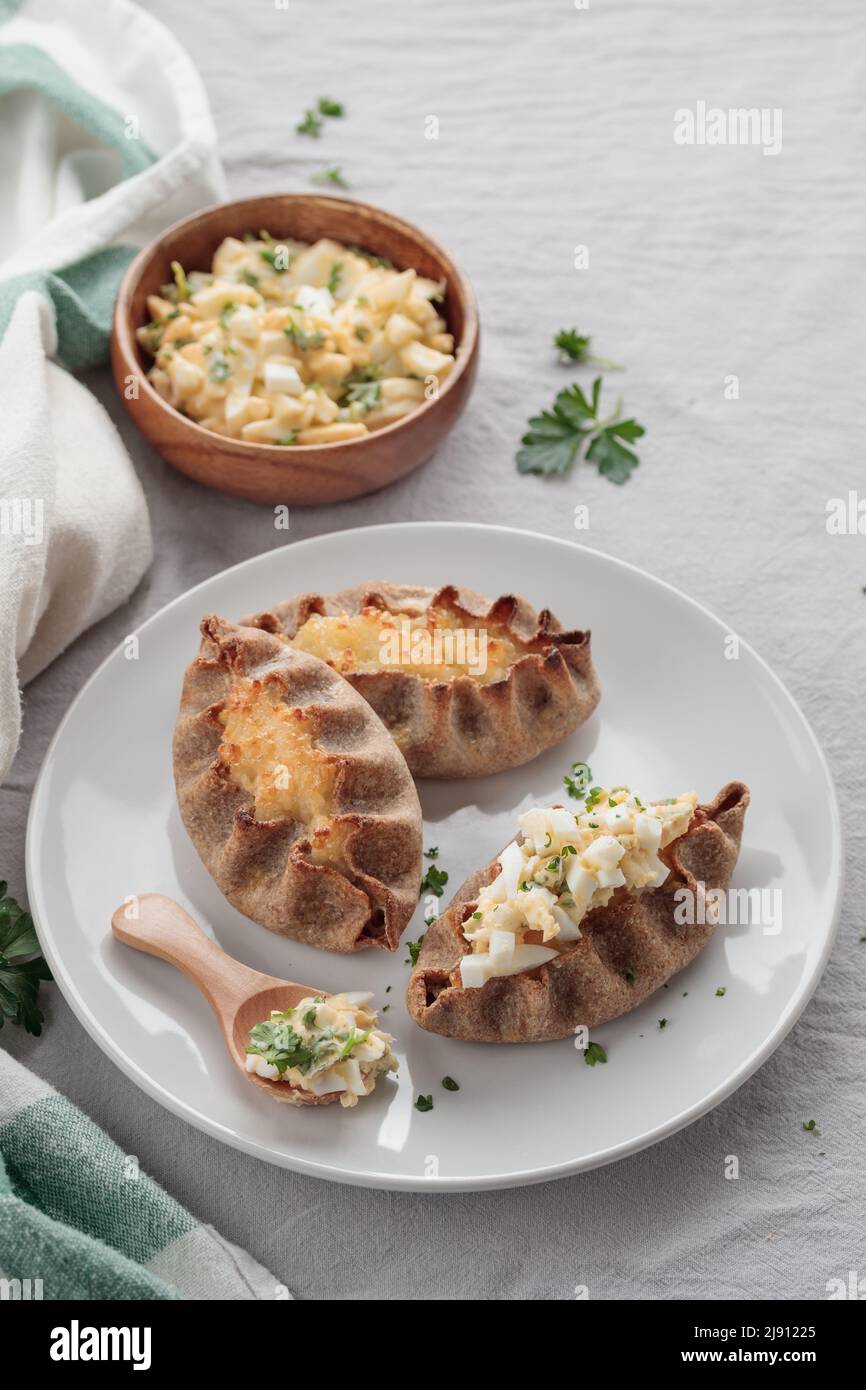 Traditional Finnish pastry - Karelian rye pie with rice porridge and an ...