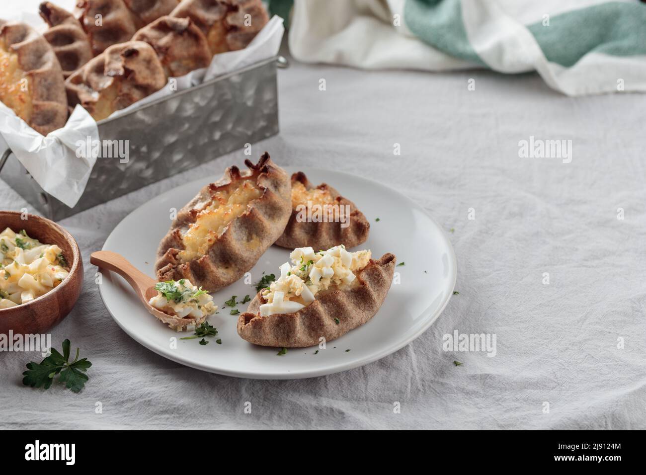 Traditional Finnish pastry - Karelian rye pie with rice porridge and an ...