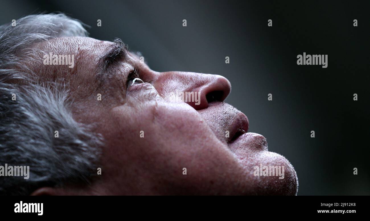 Older man in crisis looking at sky with hope and faith Stock Photo - Alamy