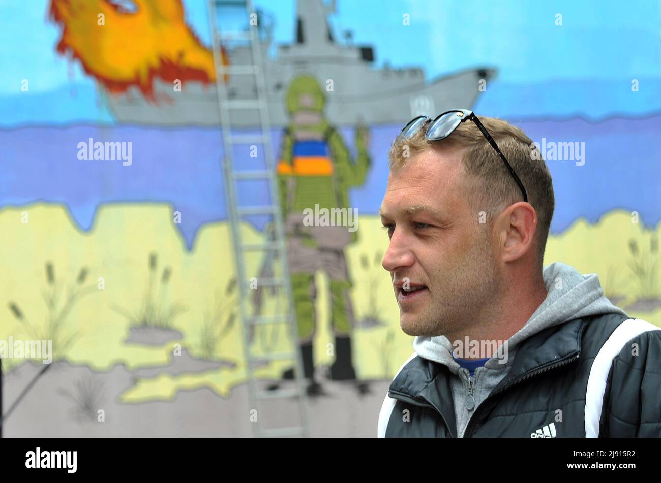 ZAPORIZHZHIA, UKRAINE - MAY 19, 2022 - Street artist Denys Antiukov ...