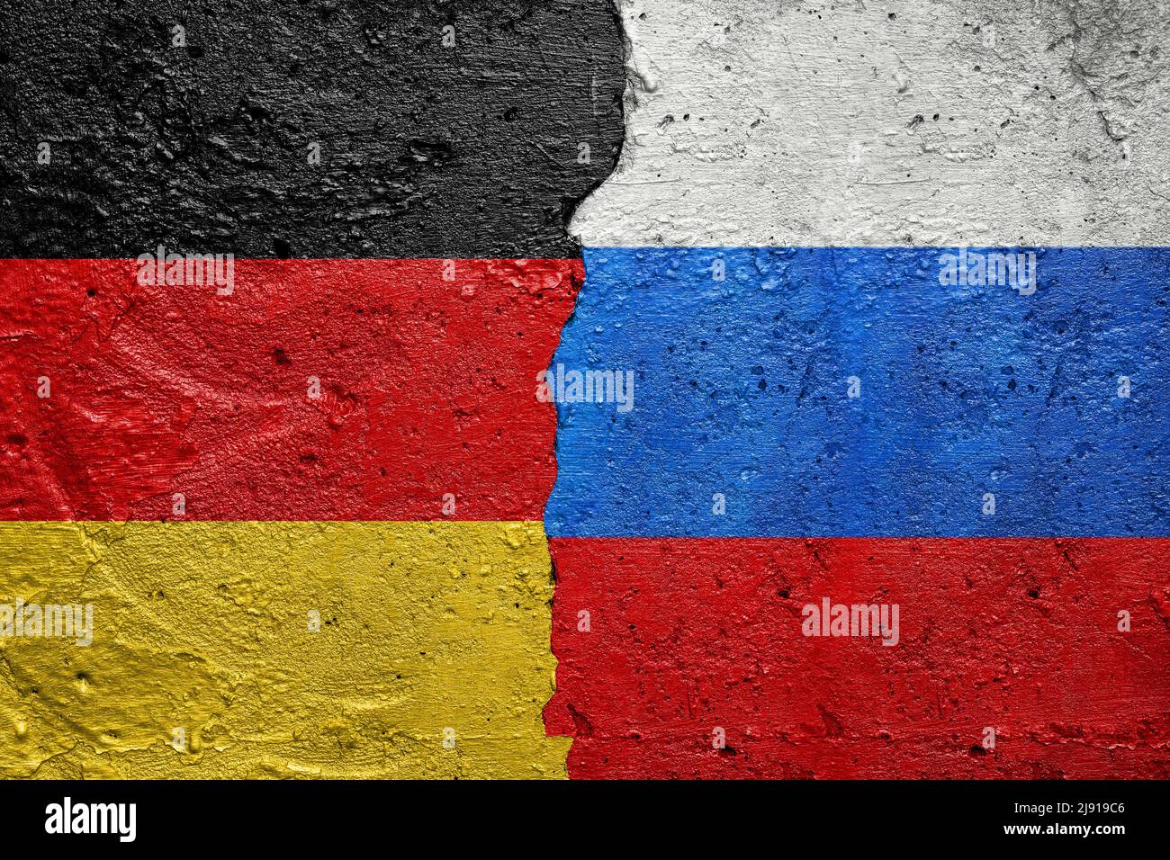 Germany vs Russia - Cracked concrete wall painted with a Germans flag ...