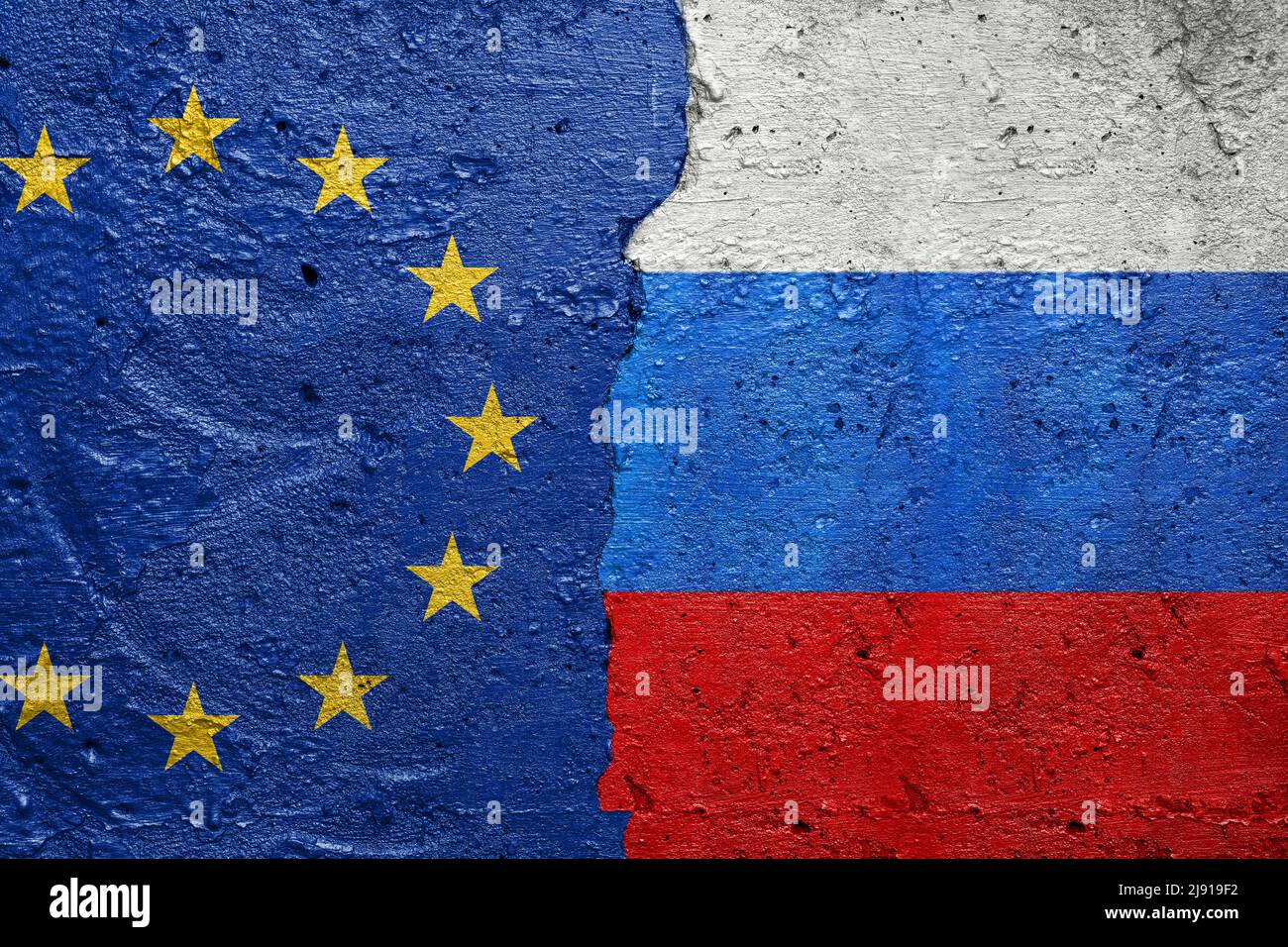European Union vs Russia - Cracked concrete wall painted with a EU flag ...