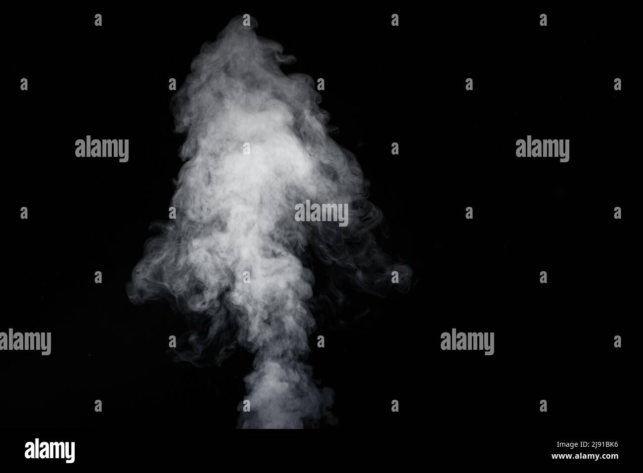 Curly white steam rising up and splashing water scattering in different ...