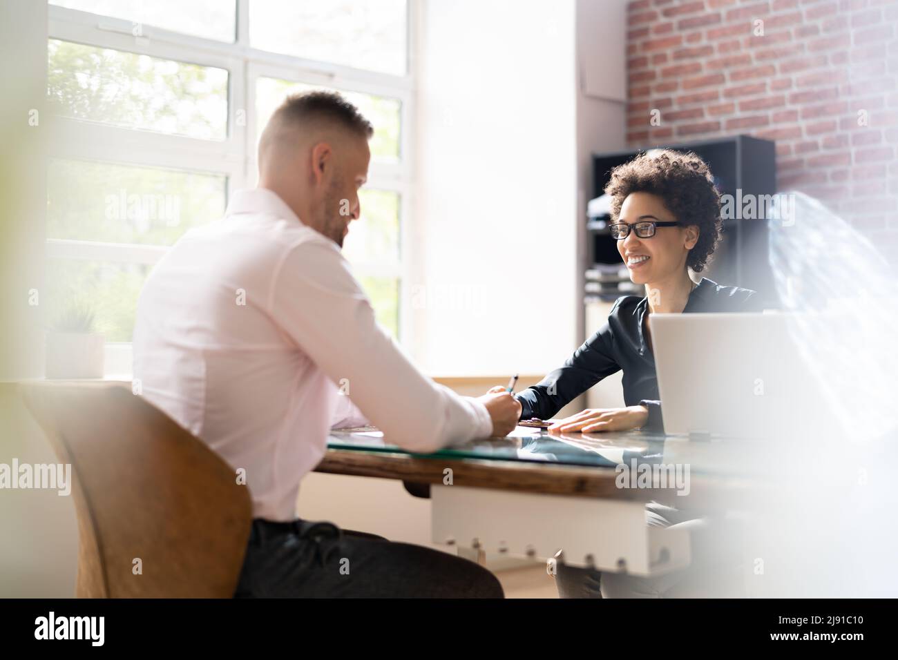 African female checking invoice hi-res stock photography and images - Alamy