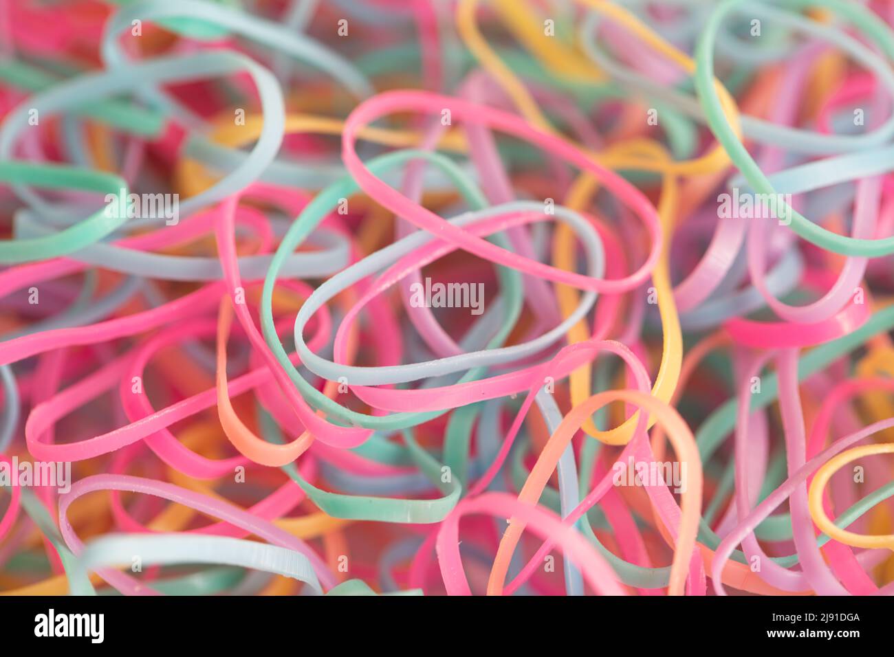small and multicolored rubber bands accessories background for design ...