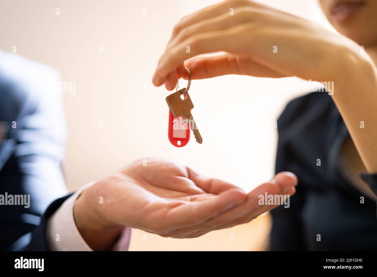 Man passing woman house keys hi-res stock photography and images - Alamy