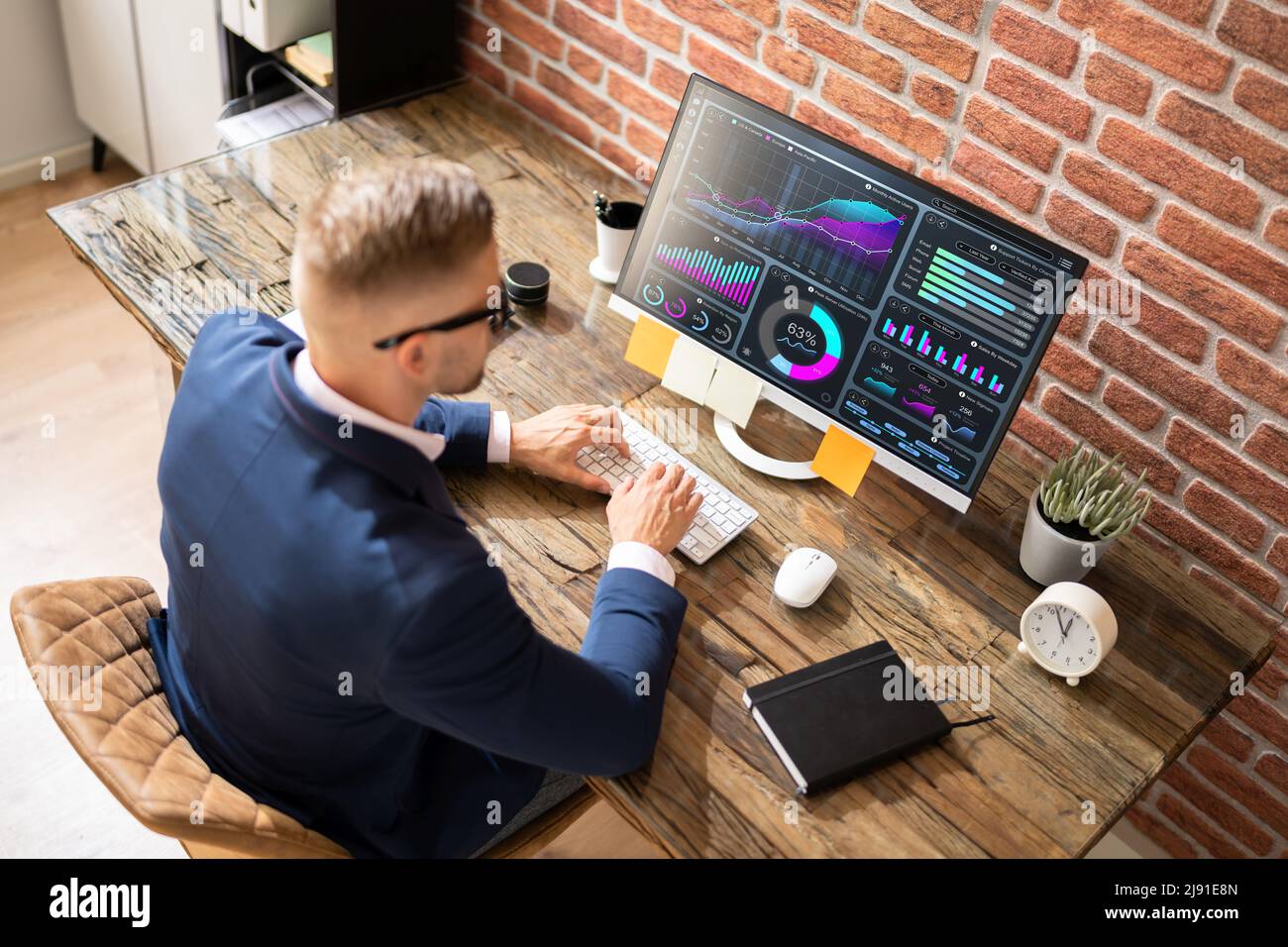 Business KPI Data Analyst Man Using Computer Stock Photo - Alamy