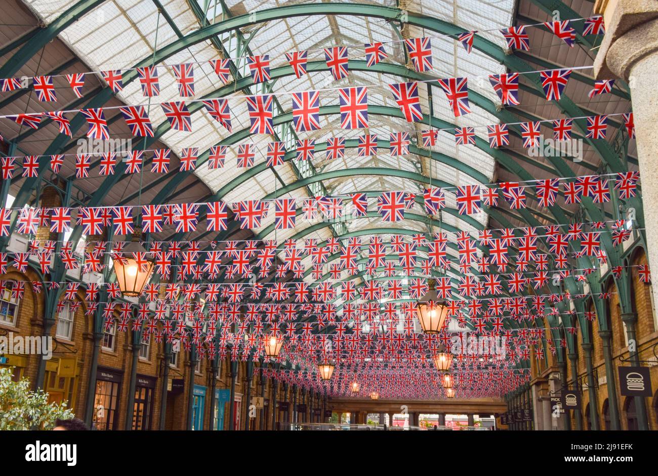 London, UK. 19th May 2022. Thousands of Union Jack flags hang in Covent ...