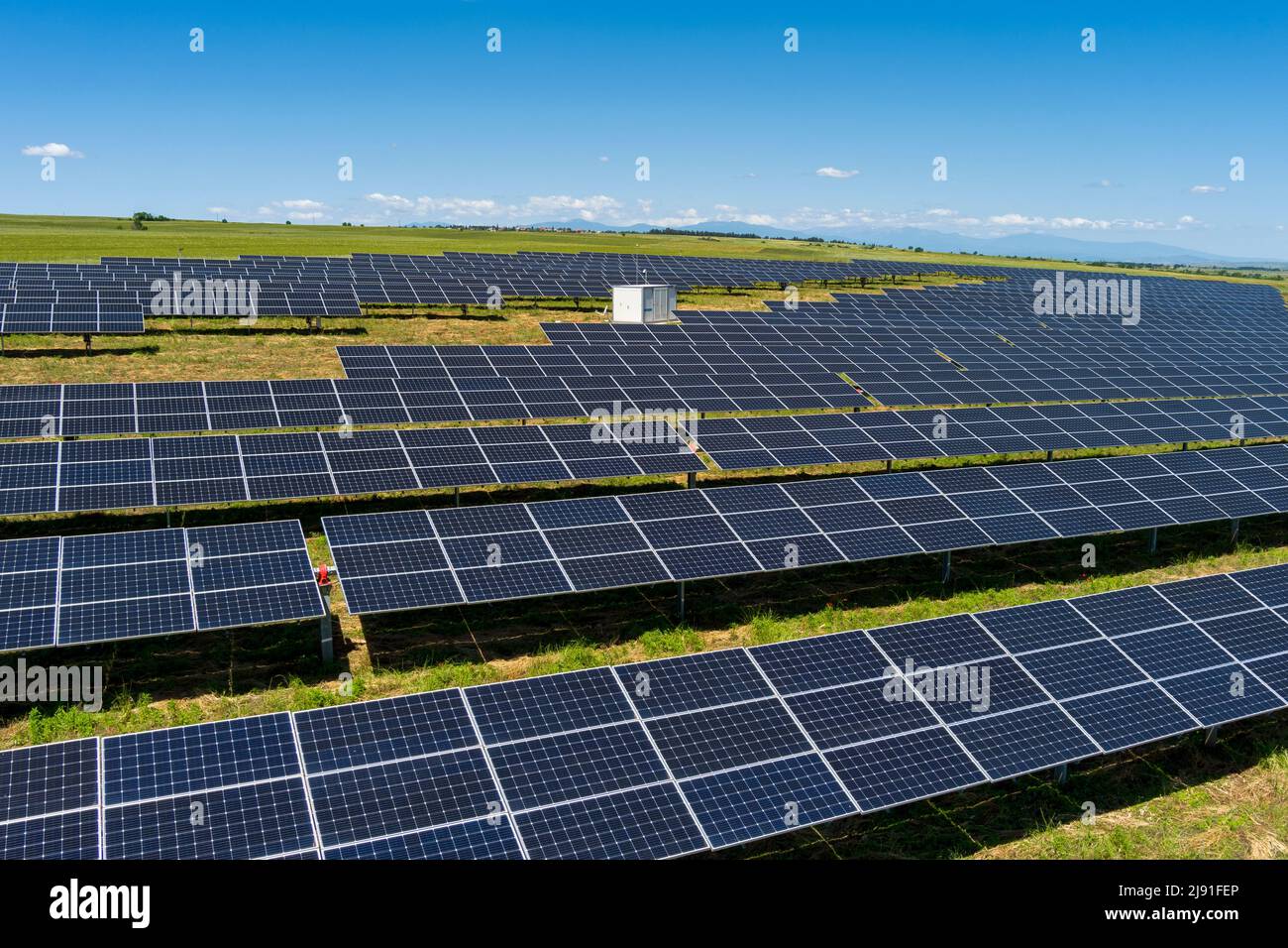 Aerial view photovoltaic panels park on green field in north Greece ...