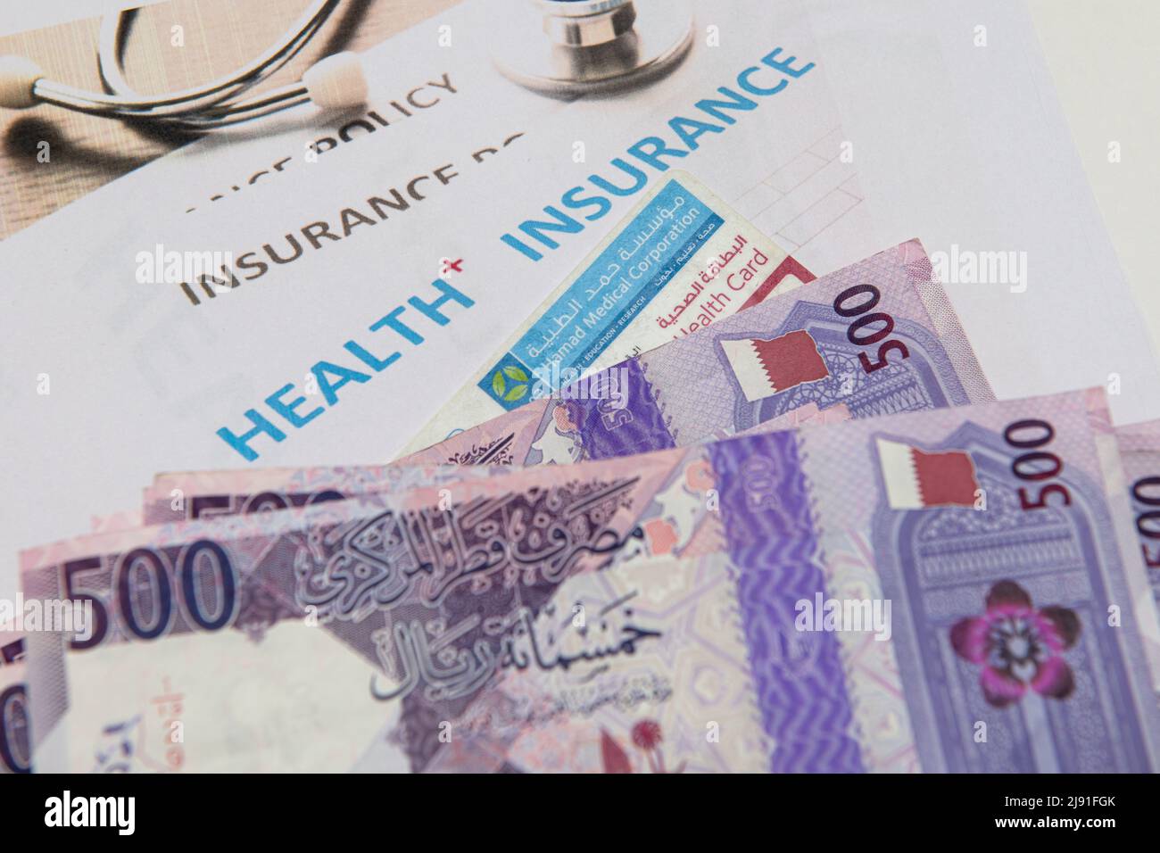 Health insurance form with Qatari Bank Note 500. top view Stock Photo ...