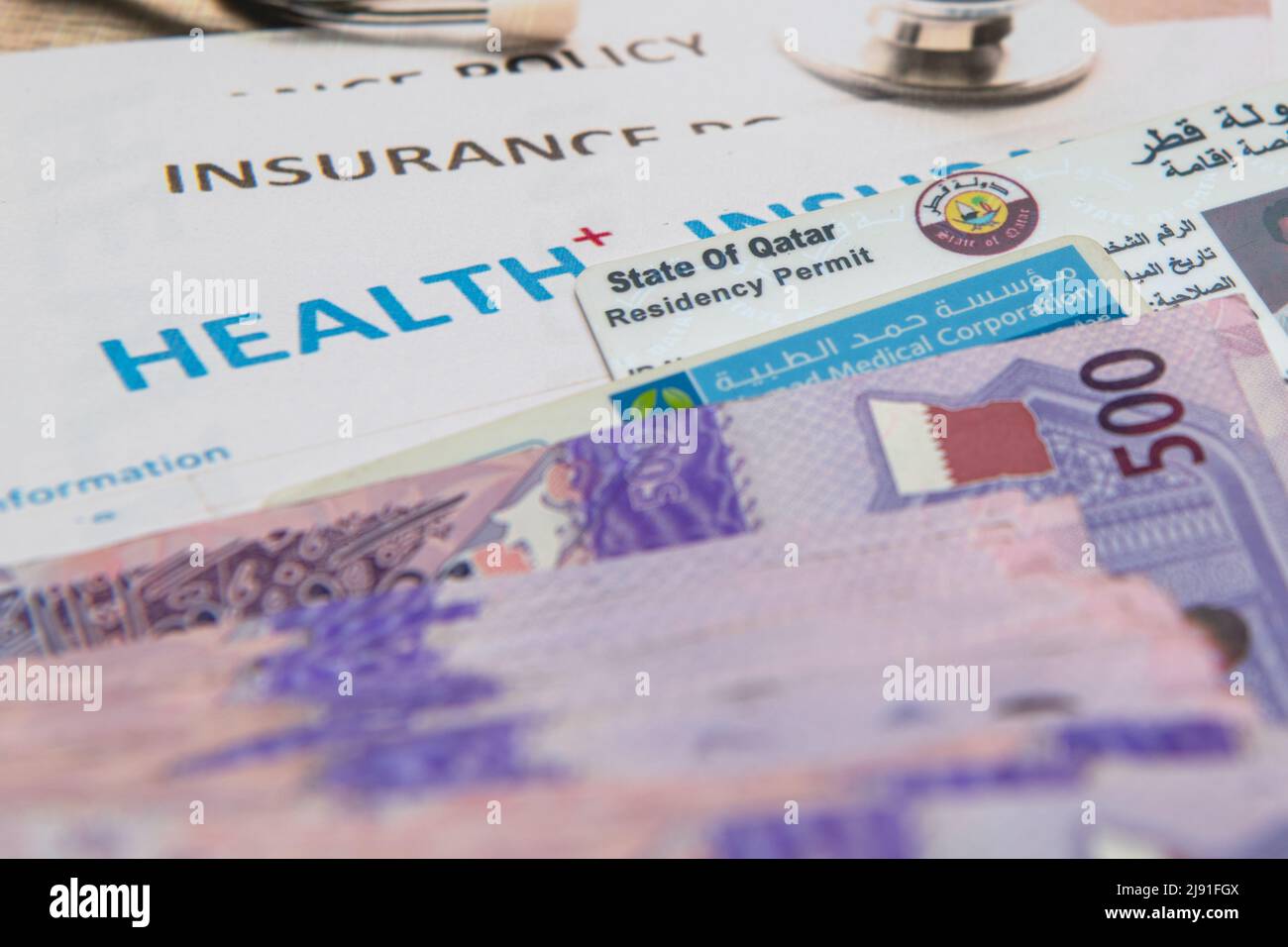 Health insurance form with Qatari Bank Note 500. top view Stock Photo ...