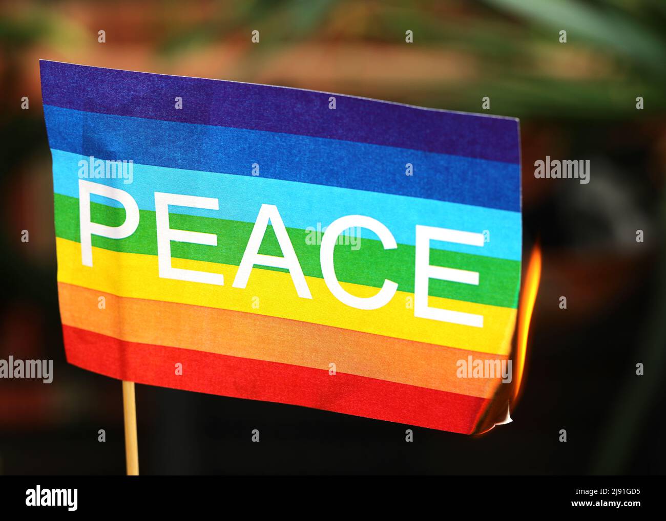 Flag of Peace with rainbow colors and the fire on the corner Stock ...