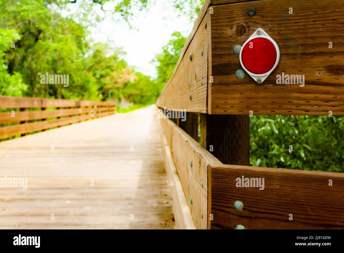 A red reflective safety marker on a trail bridge Stock Photo - Alamy
