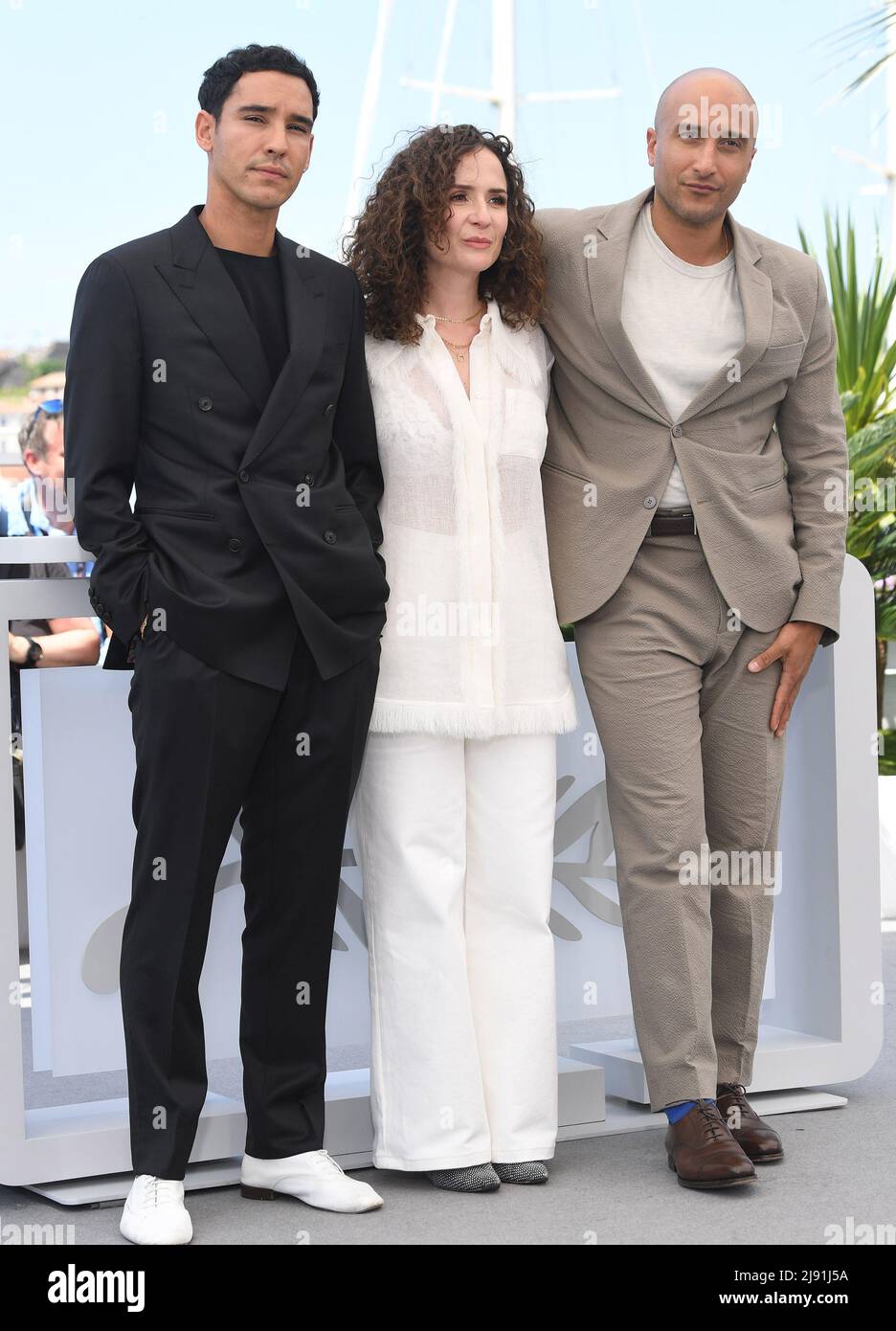 Cannes, France. 19th May, 2022. French actor Adam Bessa, producer Julie ...