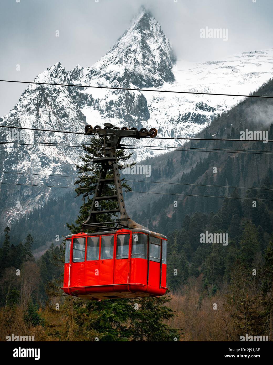 Cable car cabin in mountains with forest Stock Photo - Alamy