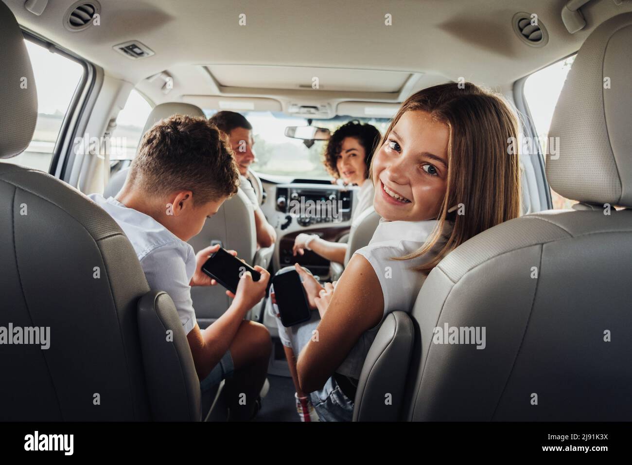 Cheerful Caucasian Teenage Girl Smiles Into the Camera While Sitting in ...