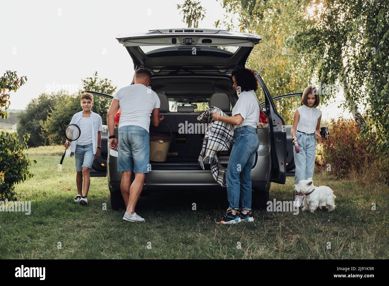 Four Members Family Traveling by Minivan Car, Mother and Father with ...