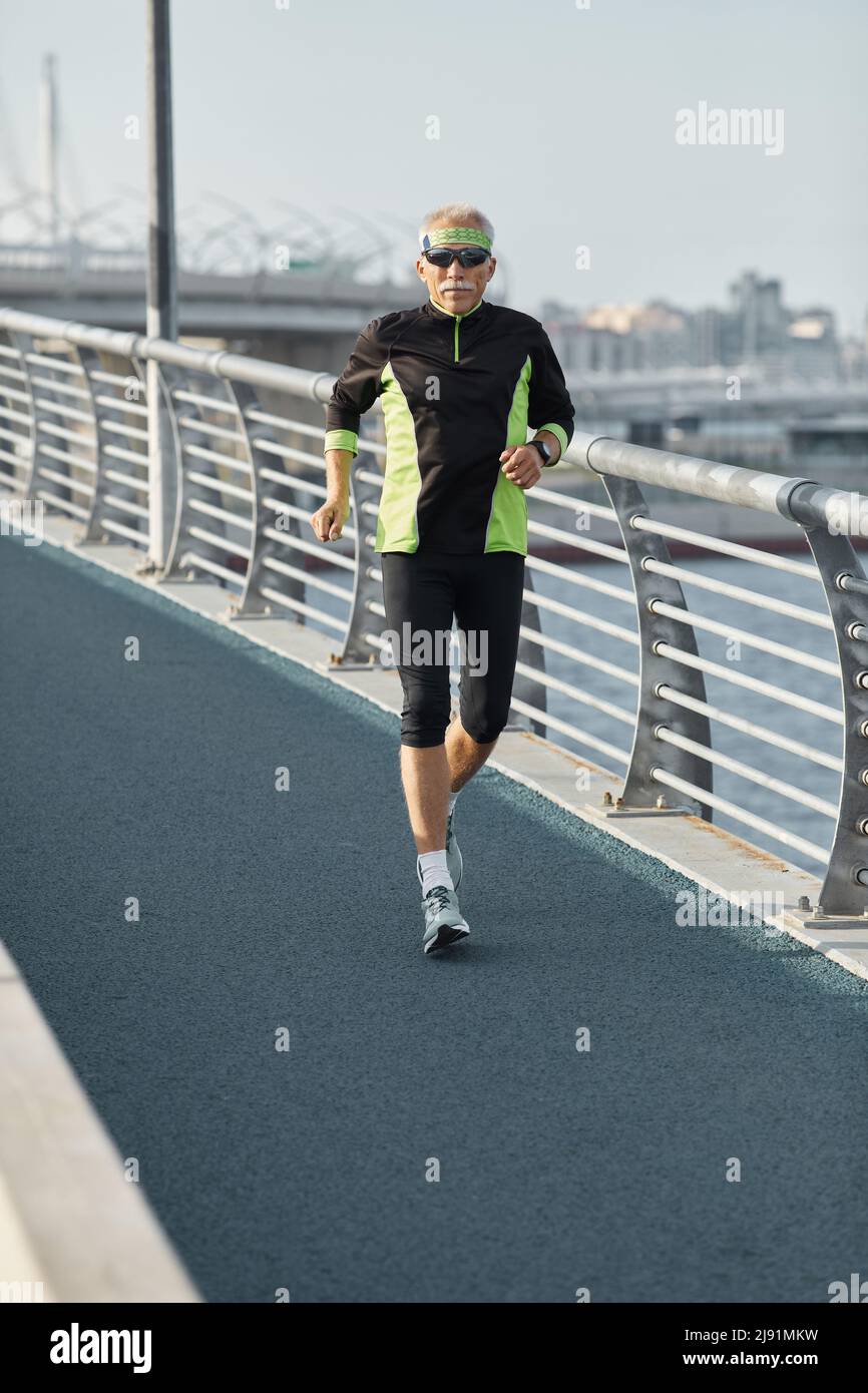 Elderly man in tracksuit hi-res stock photography and images - Alamy