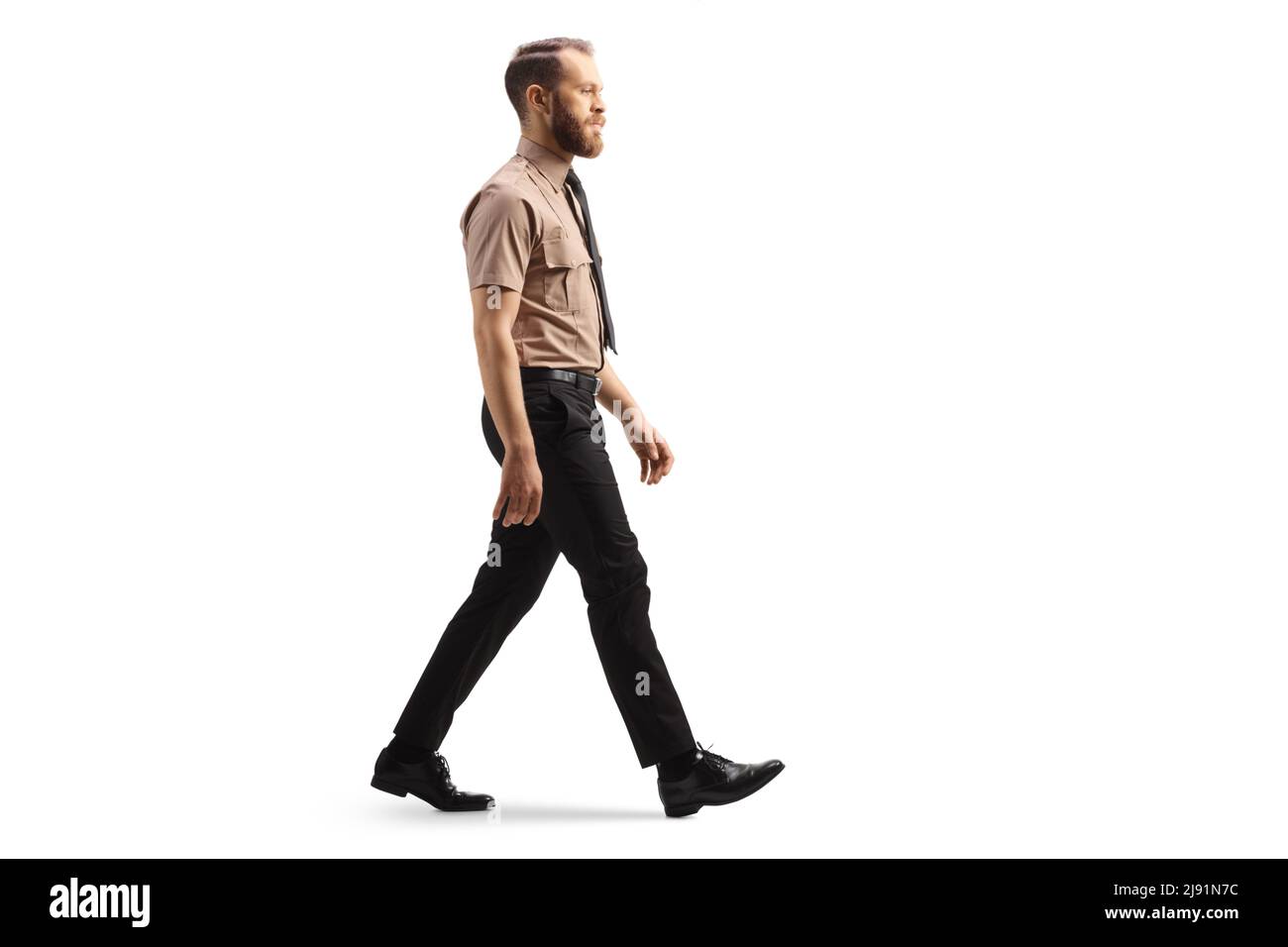Full length profile shot of a security officer walking isolated on ...