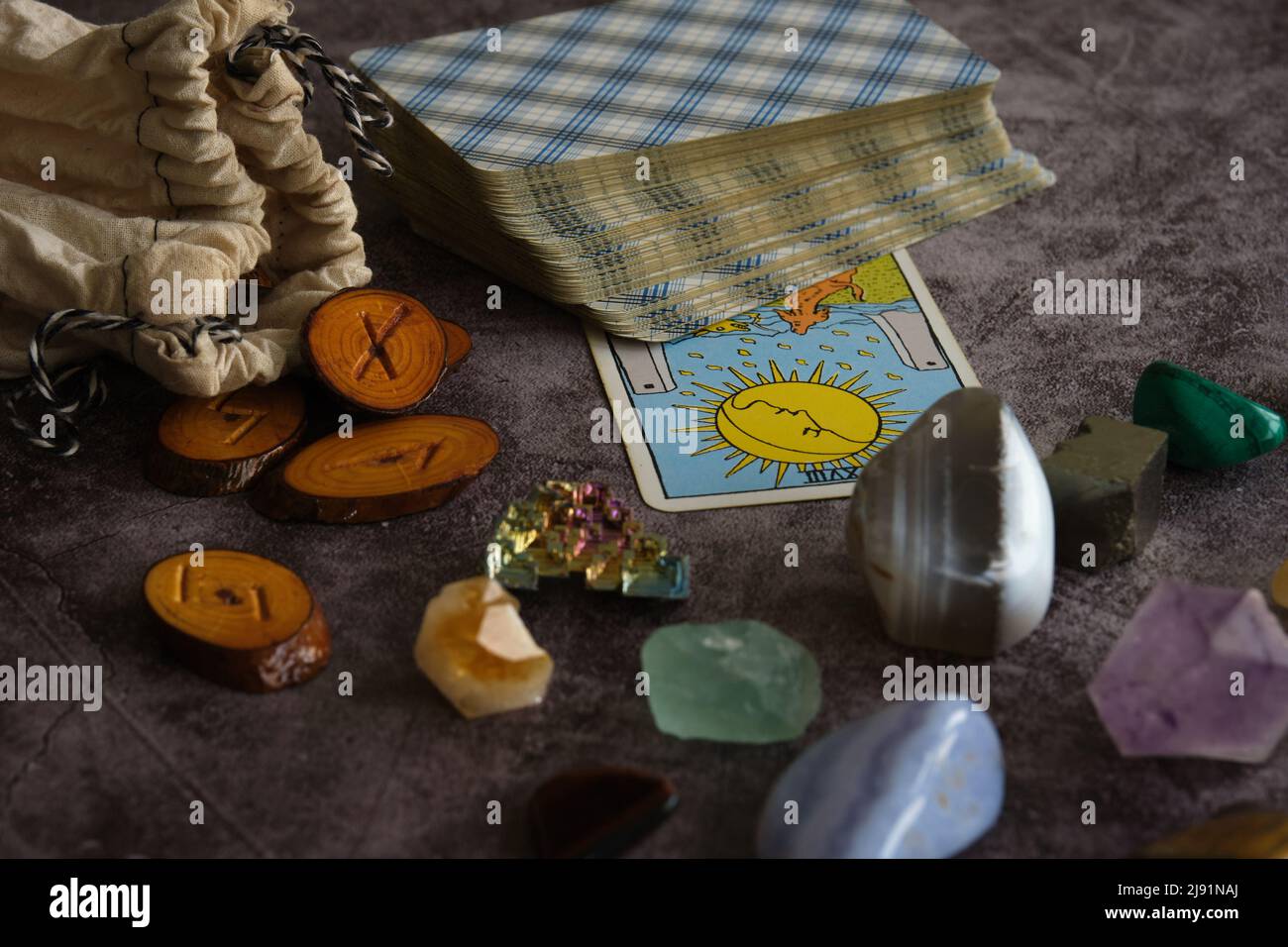 wooden runes and tarot cards on the table Stock Photo - Alamy