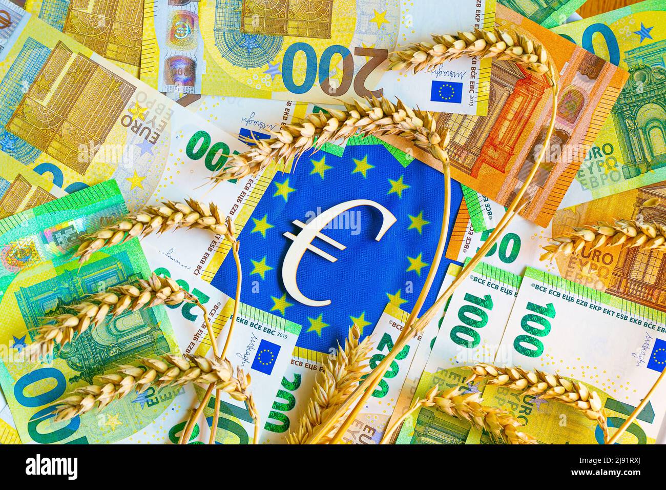 Prices for wheat and flour in Europe. spikelets of wheat and euro bills ...