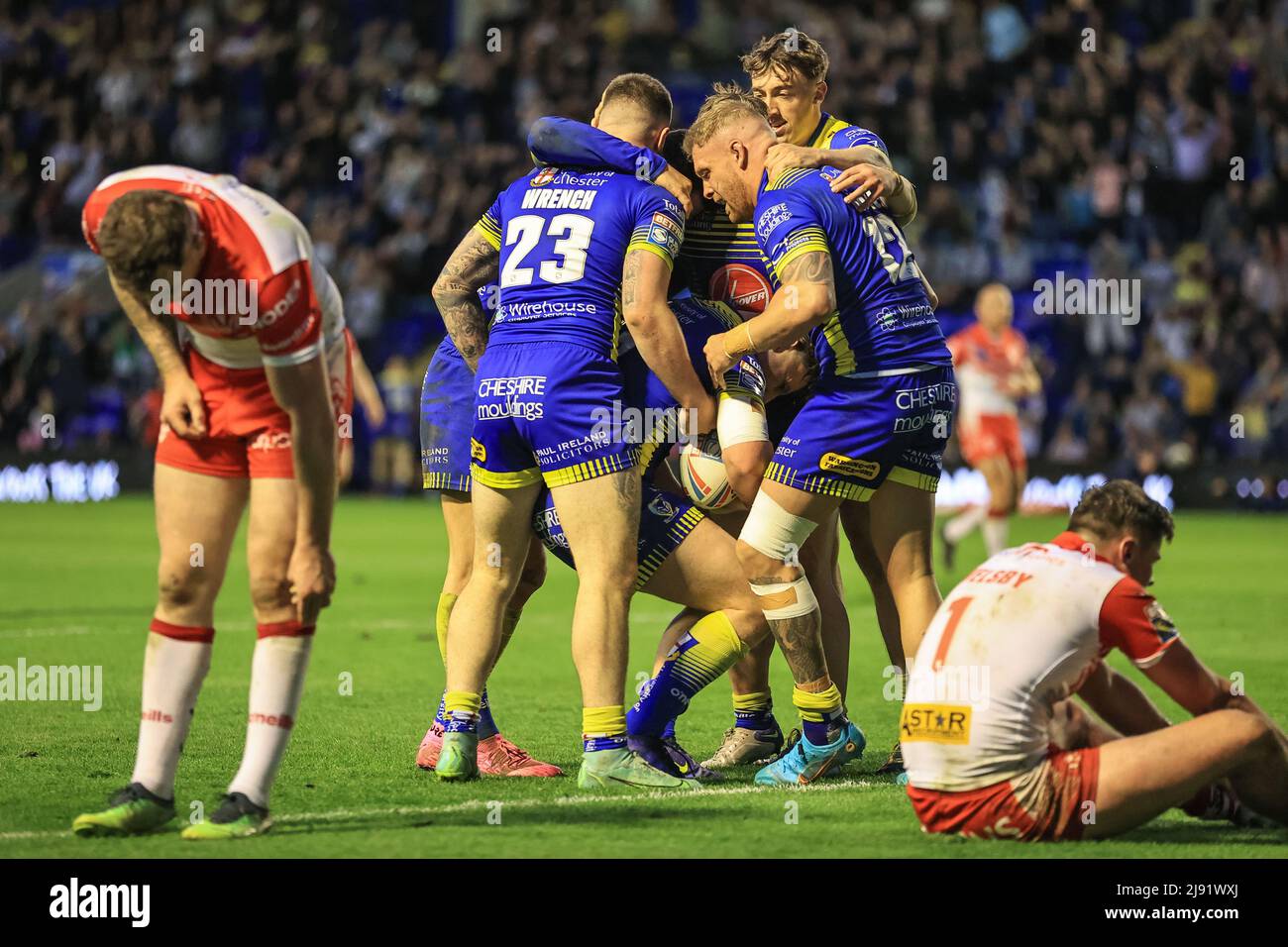 George Williams #7 of Warrington Wolves celebrates his try with team ...