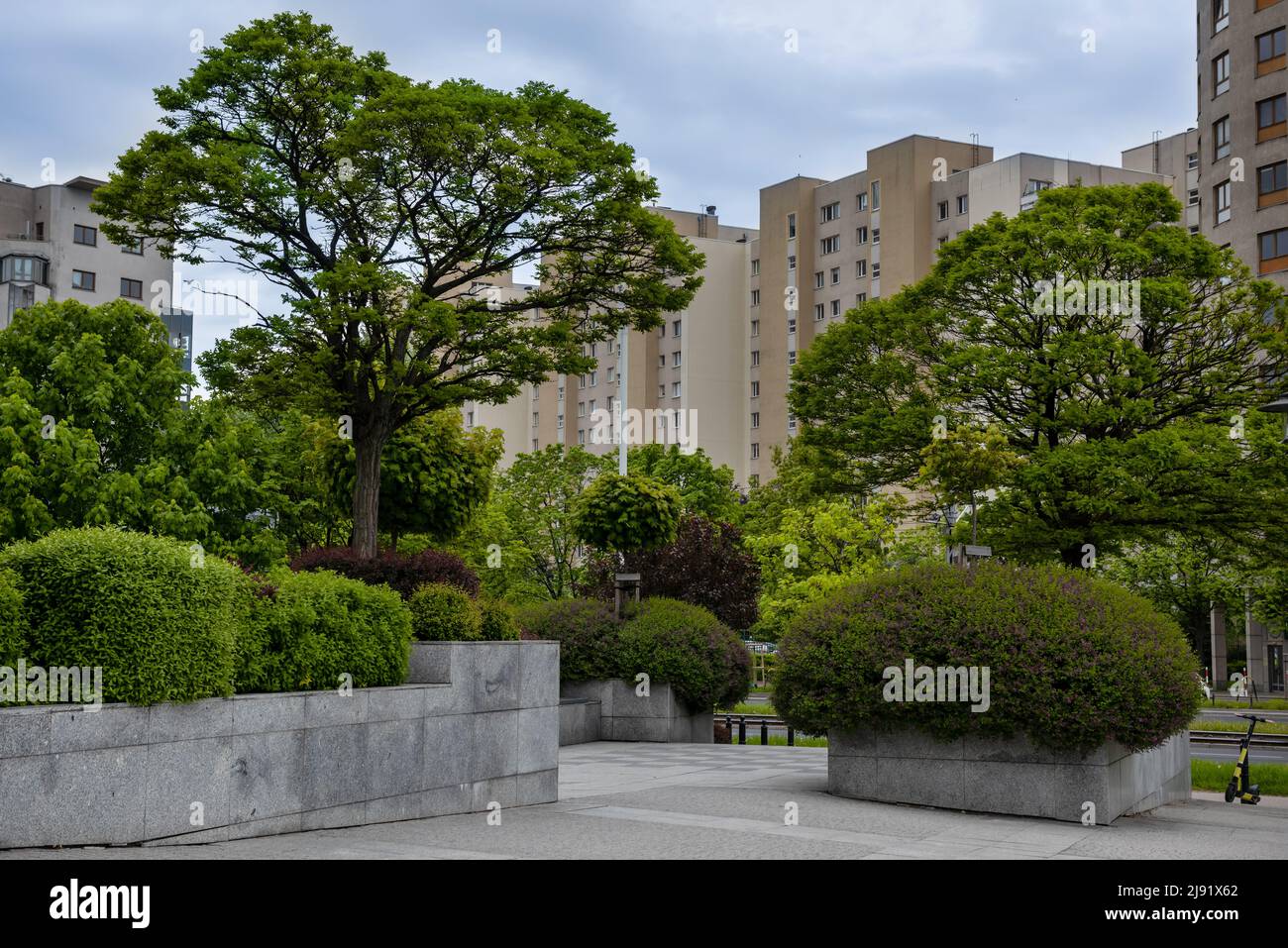 Landscaping of the city. Trees and bushes in the district Stock Photo ...