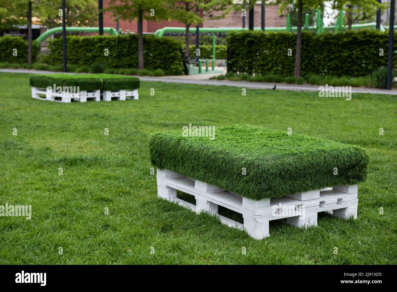 Places to sit and relax on the lawn. Pallets cover with artificial ...
