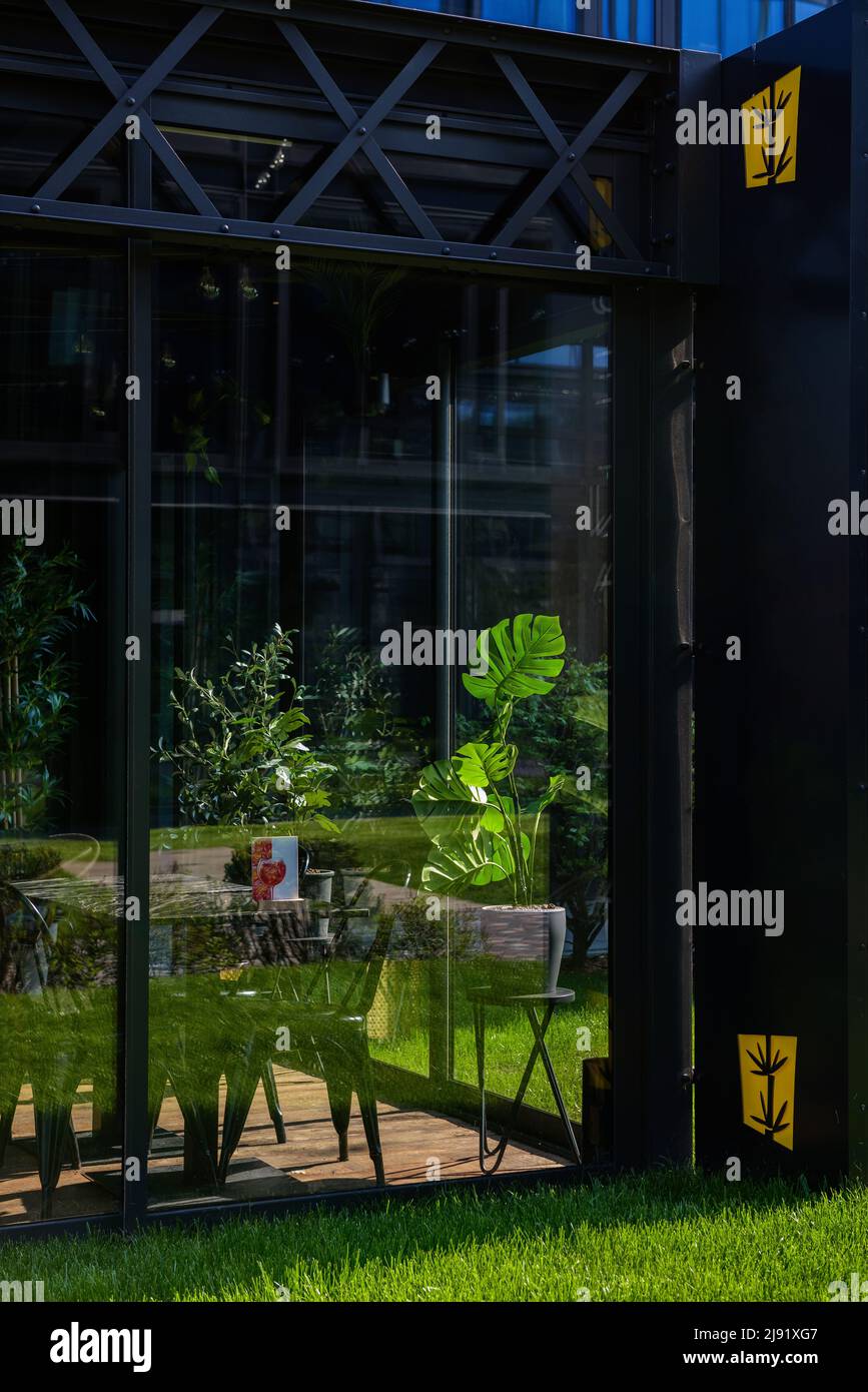 Summer terrace with glass walls. On the terrace there is a table ...