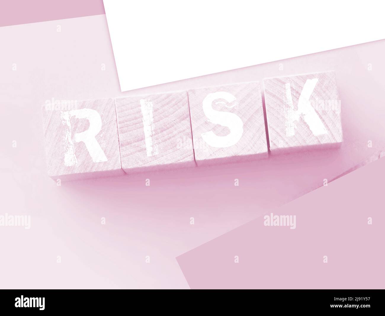 Risk Word On wooden cubes with pink wallet besides on pink background ...