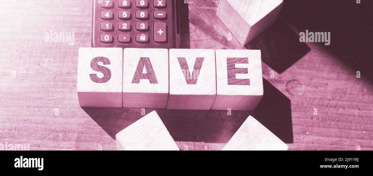 Word Save. Save text on wooden blocks and calculator. Business Concept ...