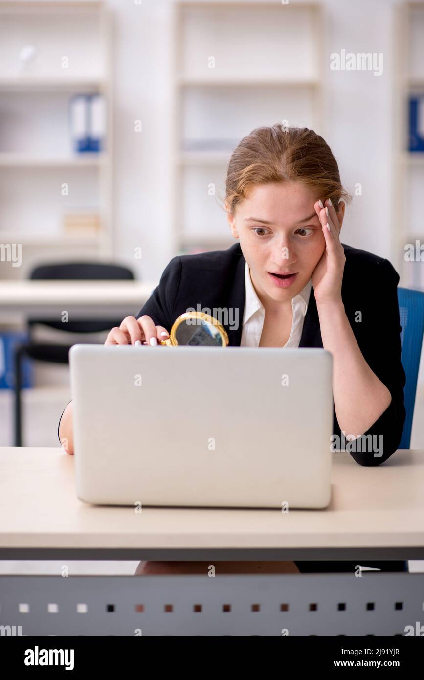 Female employee sitting at workplace Stock Photo - Alamy