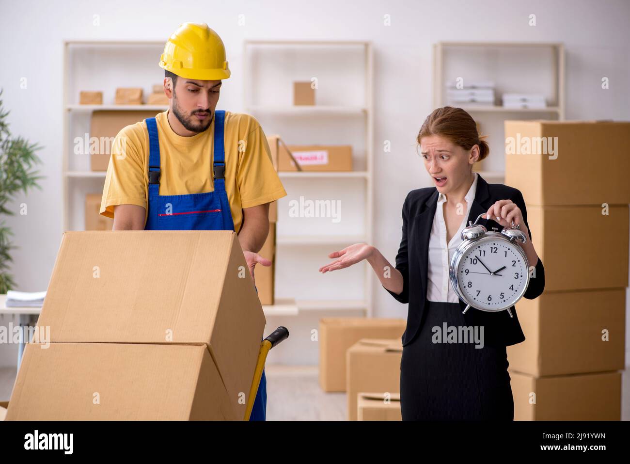 Female boss and contractor doing home relocation in time management ...