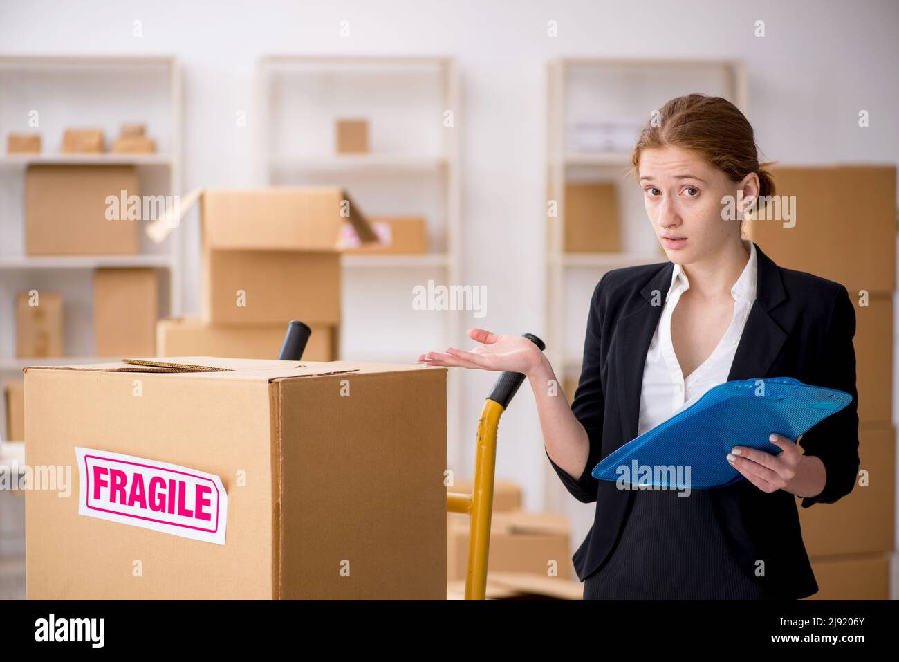 Female professional mover doing home relocation Stock Photo - Alamy