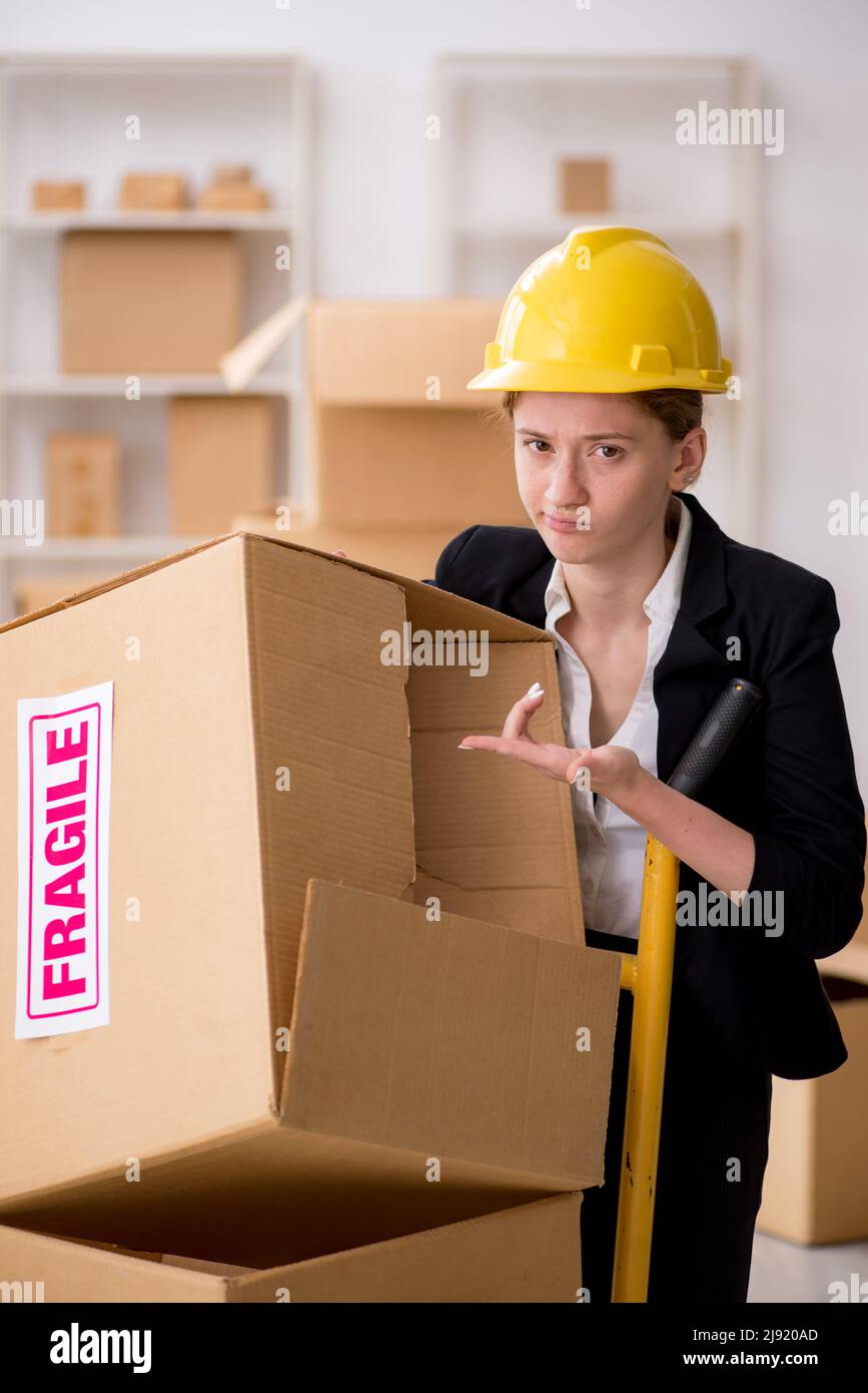 Female professional mover doing home relocation Stock Photo - Alamy