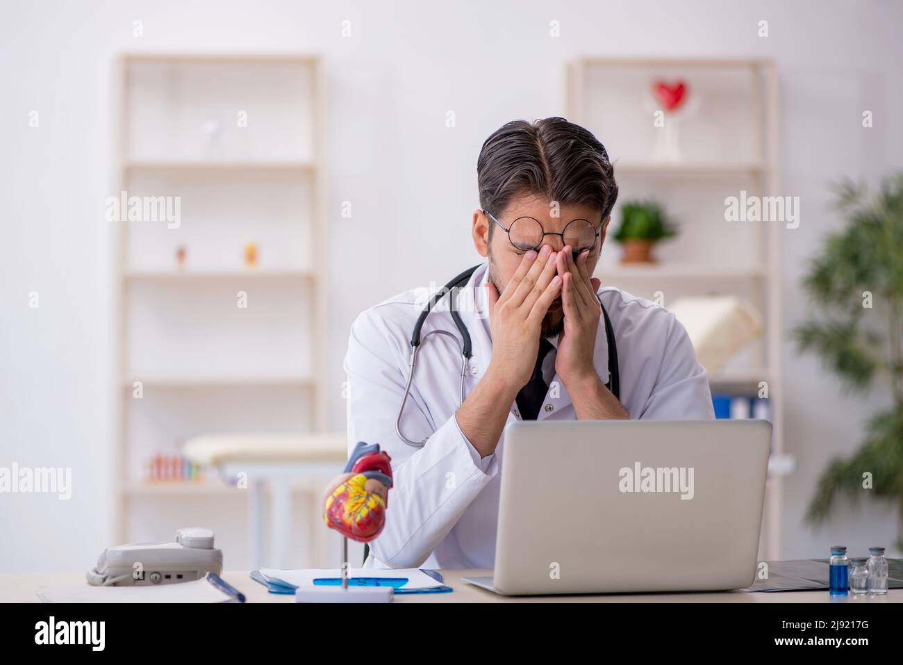 Young doctor cardiologist working at the hospital Stock Photo - Alamy