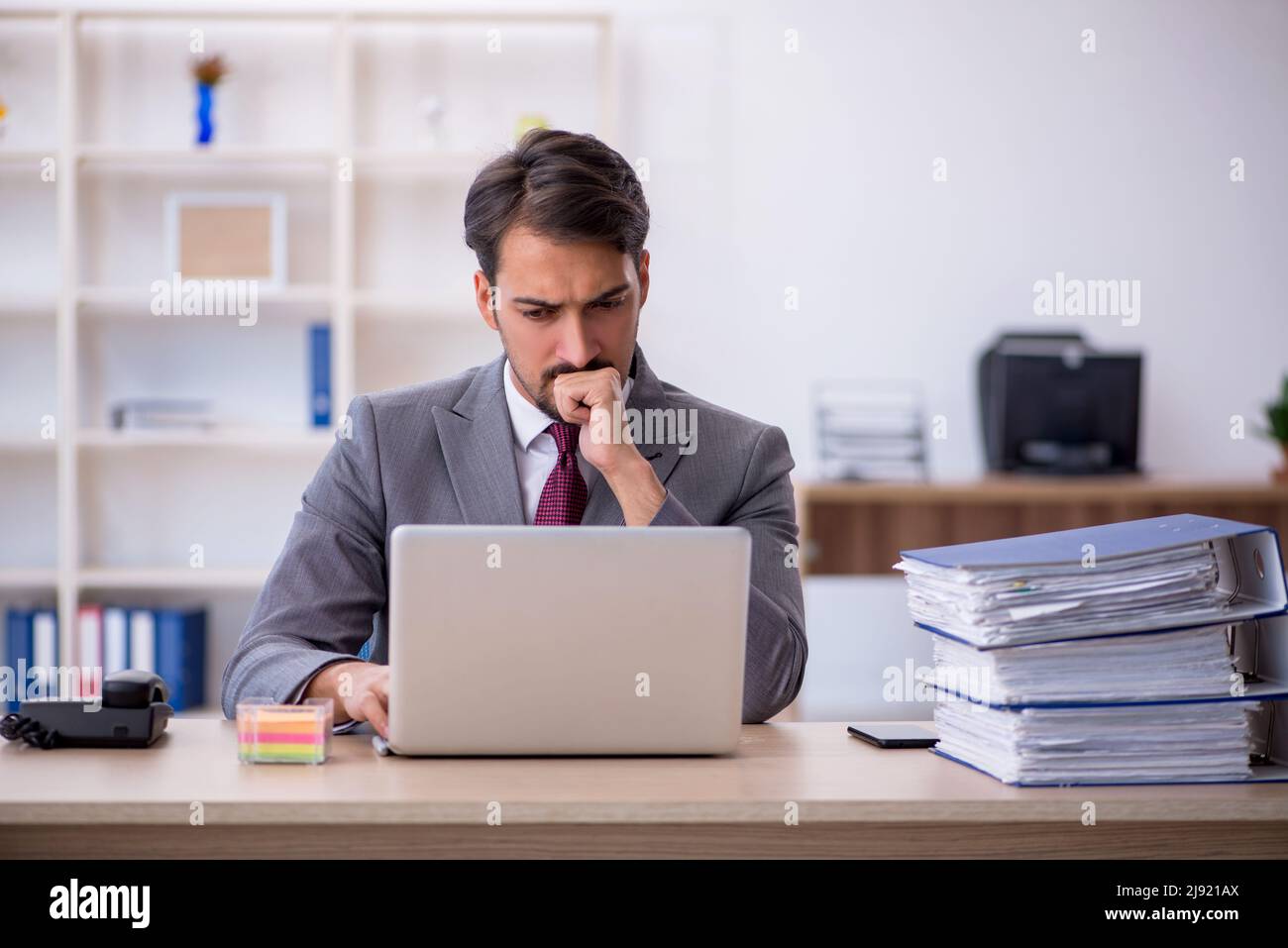 Young businessman employee working at workplace Stock Photo - Alamy