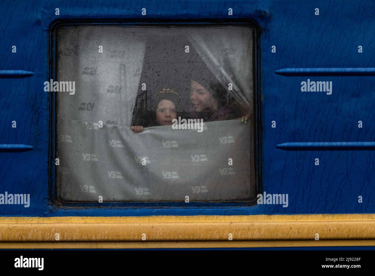 Refugees on a train for Poland at Lviv train station. Every day ...