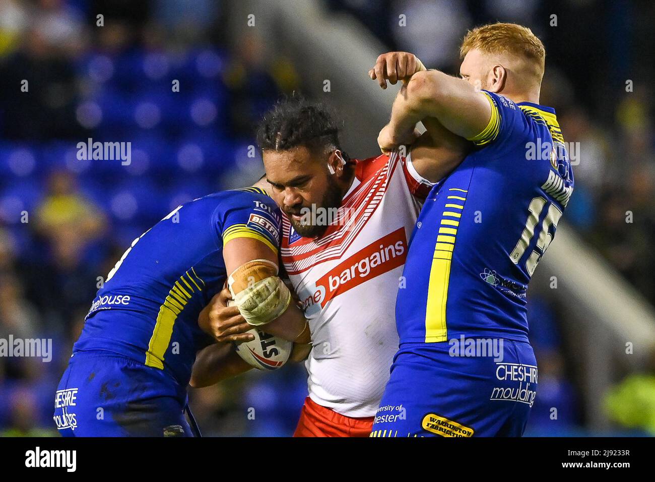 Konrad Hurrell #23 of St Helens is tackled by Joe Philbin #8 and Joe ...