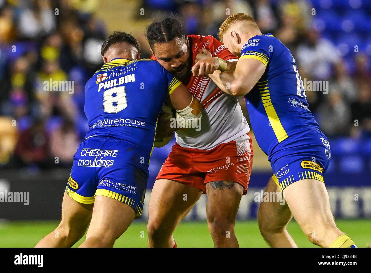 Konrad Hurrell #23 of St Helens is tackled by Joe Philbin #8 and Joe ...