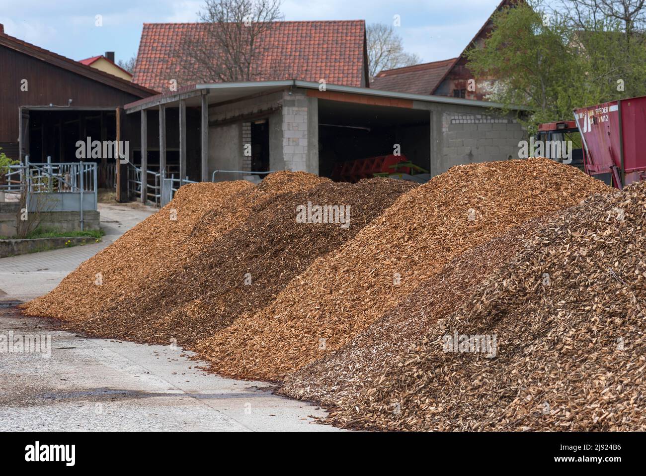 Storage of bark mulch on a farm, Bavaria, Germany Stock Photo - Alamy