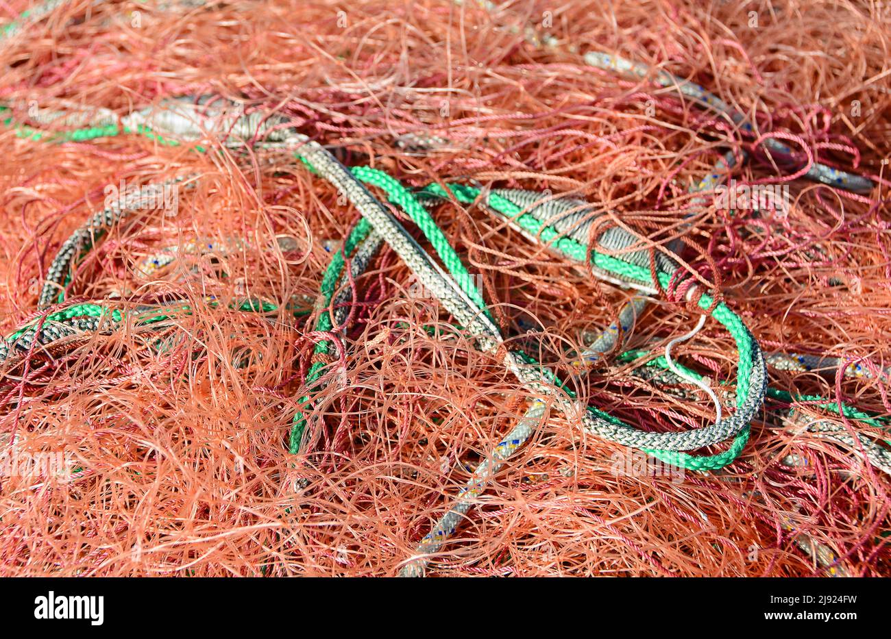 Red fishing net with rope and floats, Germany Stock Photo - Alamy