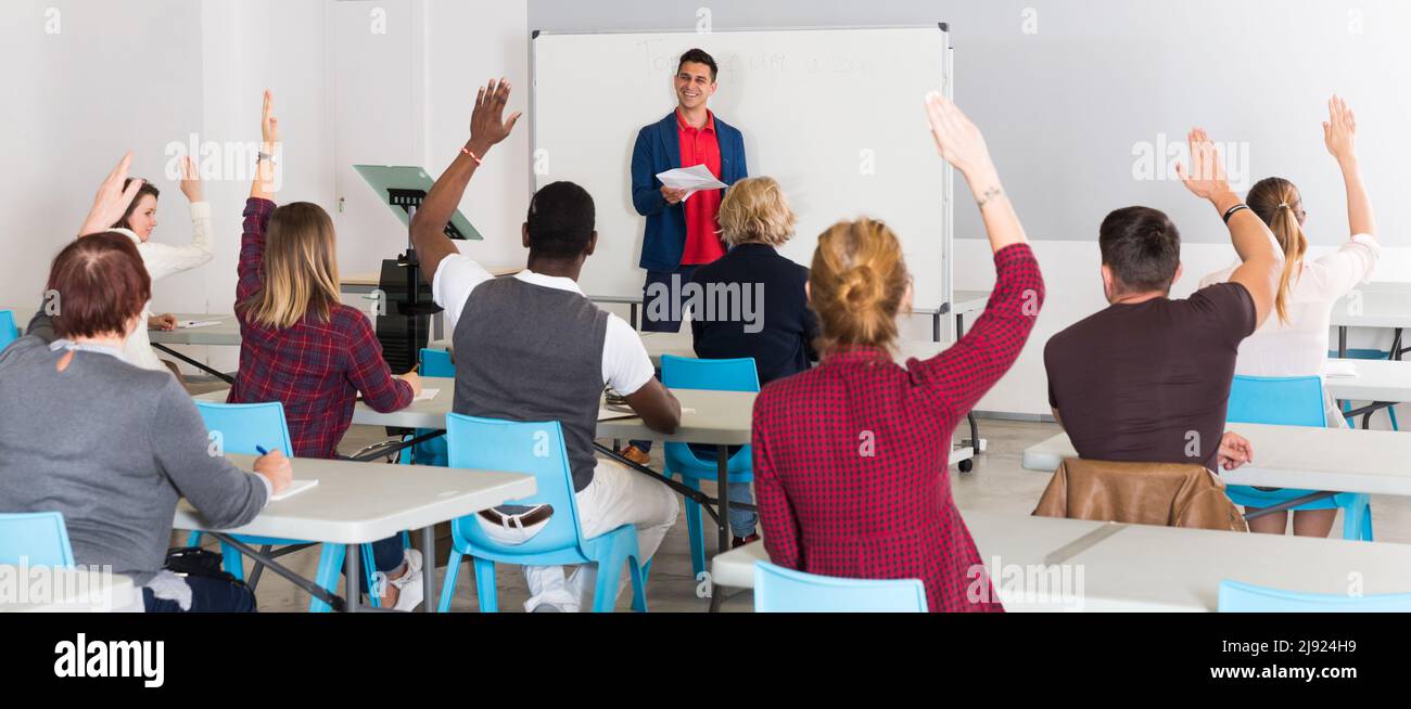Male teacher lecturing to students Stock Photo - Alamy