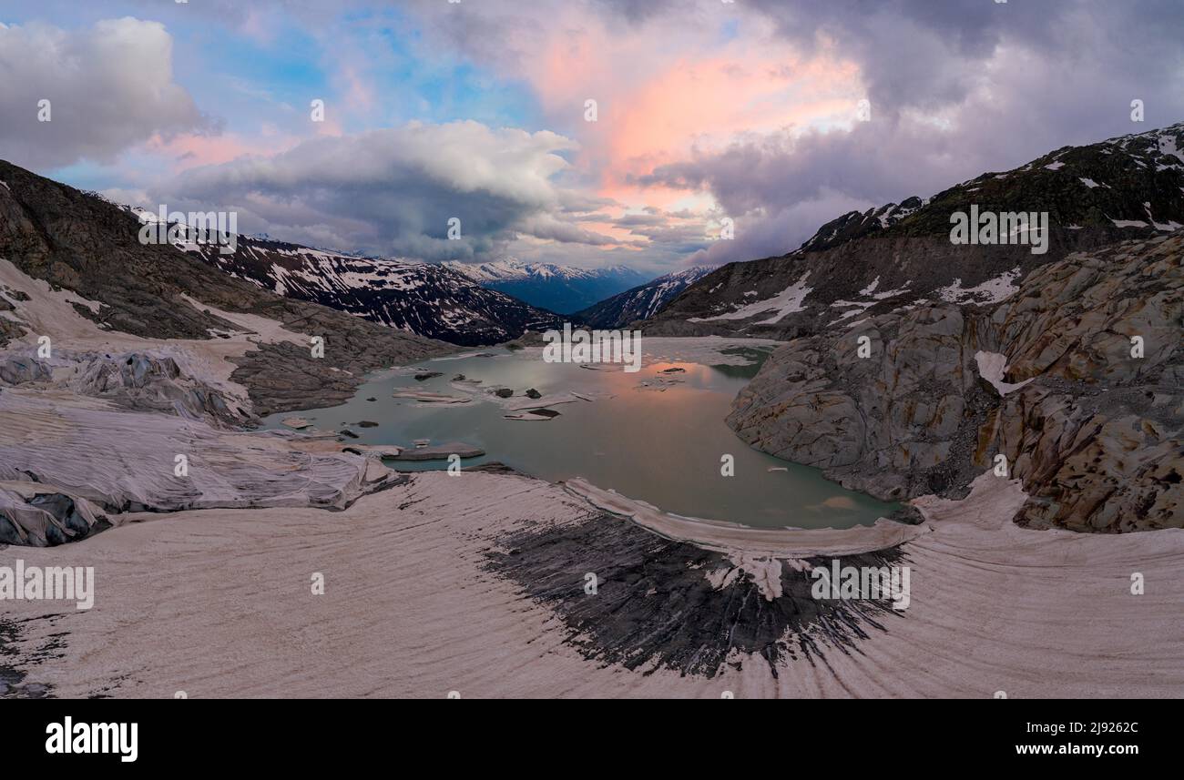 Aerial view over the Rhone glacier with the glacial lake, Canton Valais ...