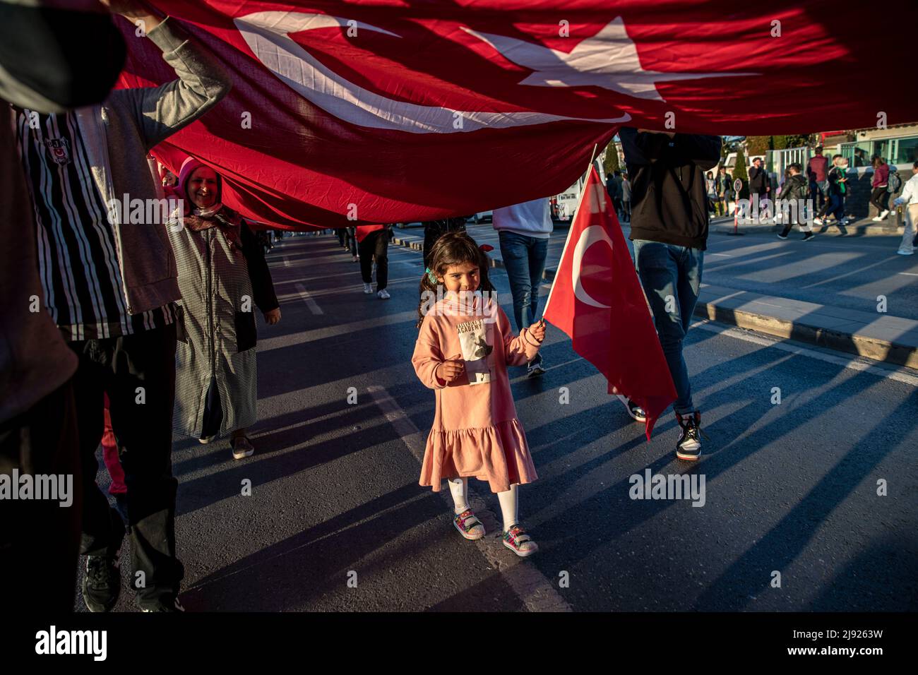 Istanbul, Turkey. 19th May, 2022. A young girl walks under the Turkish ...